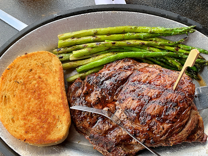 This ribeye doesn't just speak for itself&mdash;it sings a carnivorous opera with perfectly charred edges and a supporting cast of asparagus and Texas toast.