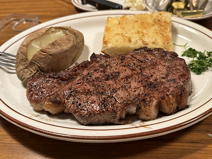 Not all heroes wear capes; some come perfectly seared on white plates with a baked potato sidekick ready to save your day.