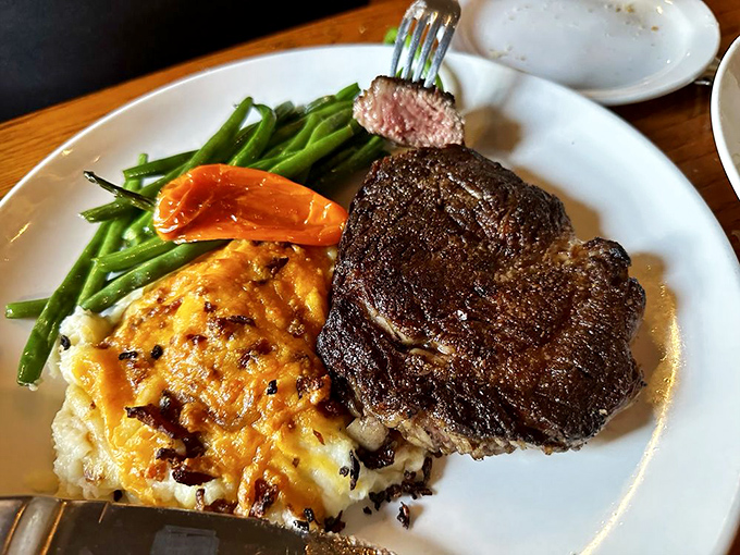 Perfection has a color, and it's that mahogany crust giving way to a rosy center. This ribeye doesn't need a filter &ndash; it needs your undivided attention.