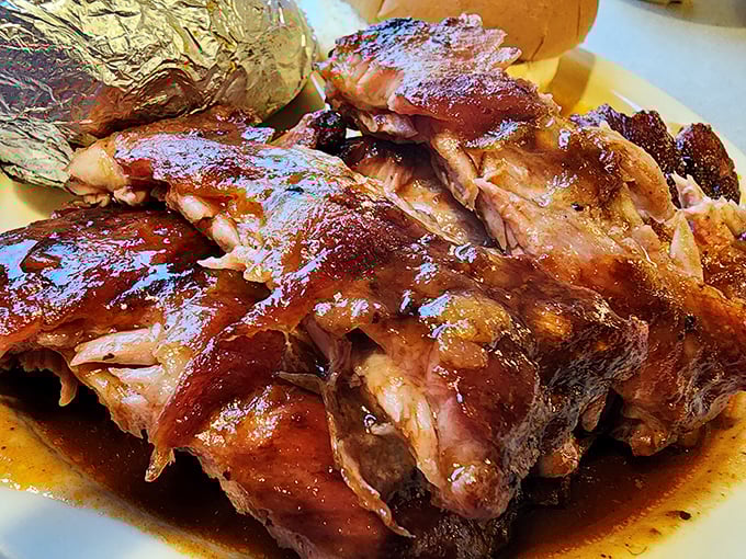 These ribs aren't just cooked, they're coaxed into tenderness through a slow dance with smoke and time, resulting in that perfect pink ring that barbecue aficionados chase like treasure hunters.