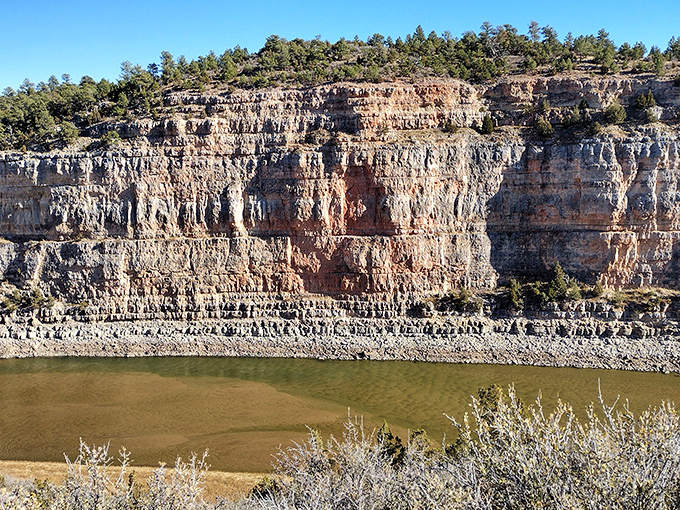 These layered cliffs tell Wyoming's geological story better than any textbook. Nature's own history book, written in stone.