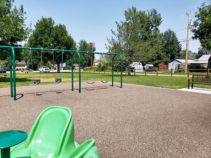 Simple pleasures: a neighborhood park where generations of Spearfish kids have conquered the playground universe, one swing at a time.
