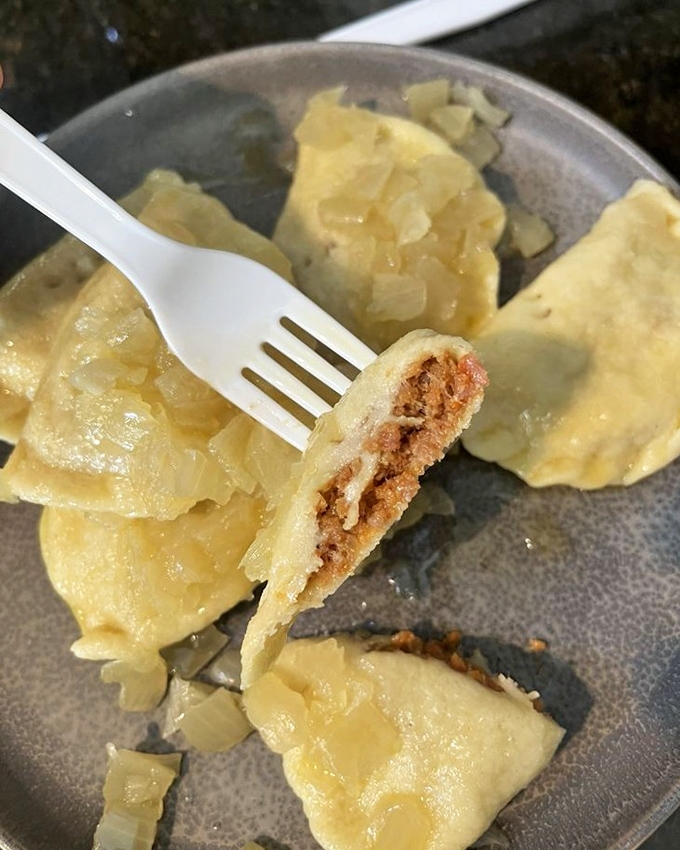 The money shot: hot sausage pierogies with that perfect golden crust. Fork-ready and absolutely begging to be devoured.