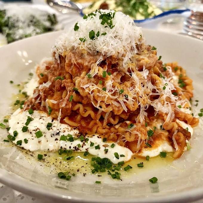 This Sausage Ragù isn't just pasta—it's a mountain of comfort crowned with a snowfall of cheese that makes you want to plant a tiny flag at the summit.