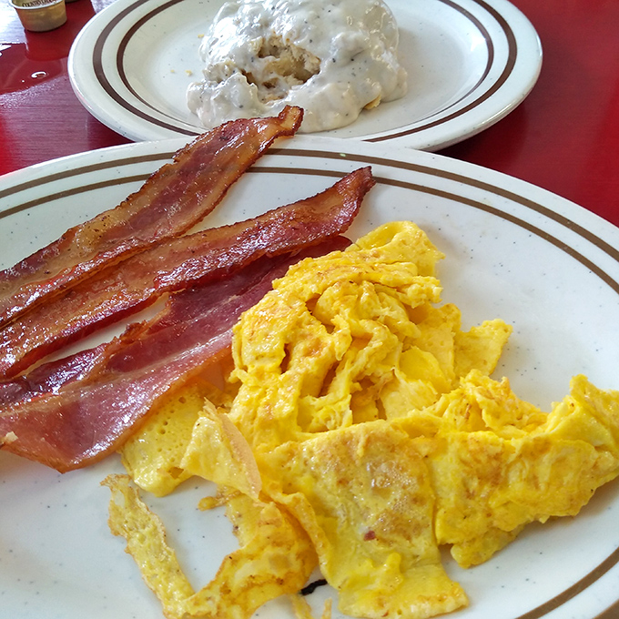 Scrambled eggs that actually look like eggs, not some pale yellow afterthought. Paired with bacon that's achieved that perfect crisp-yet-chewy harmony.
