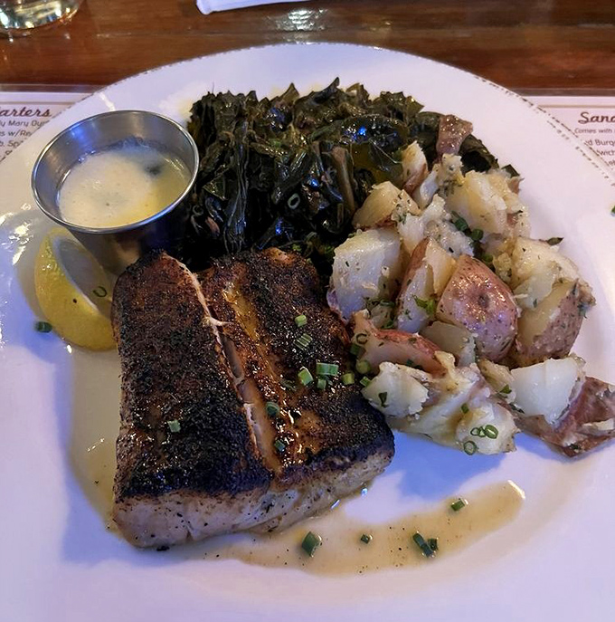 Sea bass so perfectly seared it should have its own Instagram account. Those crispy edges hiding that buttery flesh deserve a standing ovation.