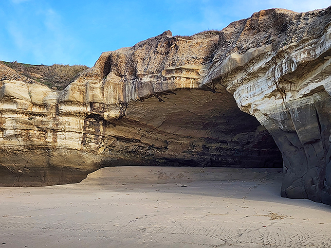 Mother Nature's living room—this sea cave offers temporary shelter from sun and wind, carved by millennia of persistent waves.