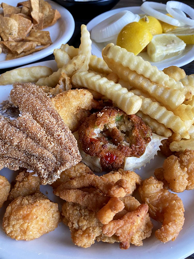 Golden-fried treasures from land and sea share plate space in perfect harmony&mdash;like a delicious family reunion where everyone actually gets along.
