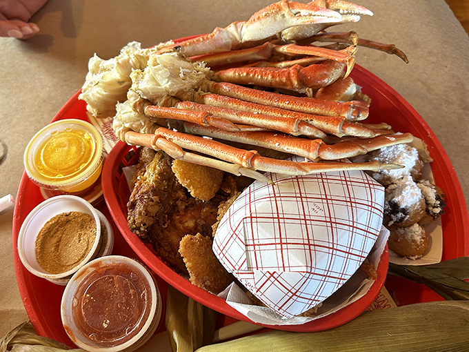 Snow crab legs arranged like nature's perfect architecture. The accompanying dipping sauces are the supporting actors in this seafood blockbuster.