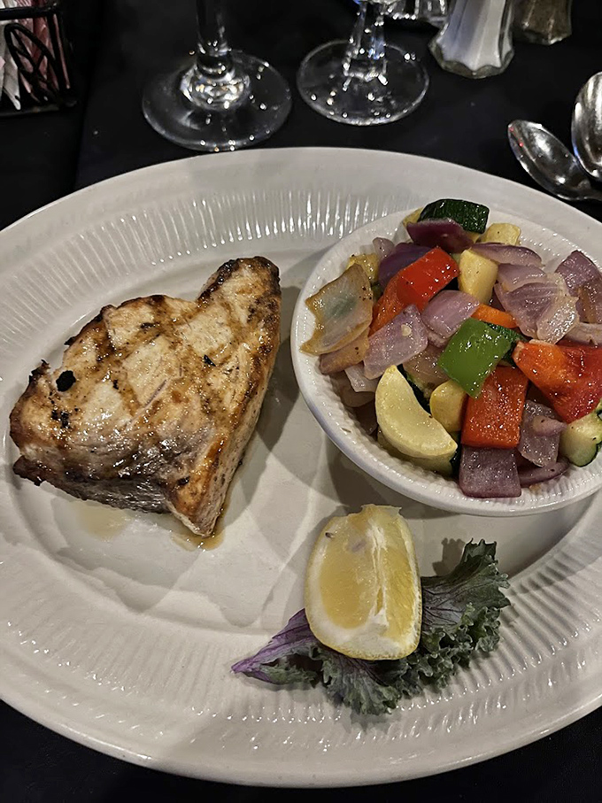 A perfectly grilled fish fillet that would make coastal restaurants jealous, served with a colorful medley of vegetables that actually deserve to share the plate. 