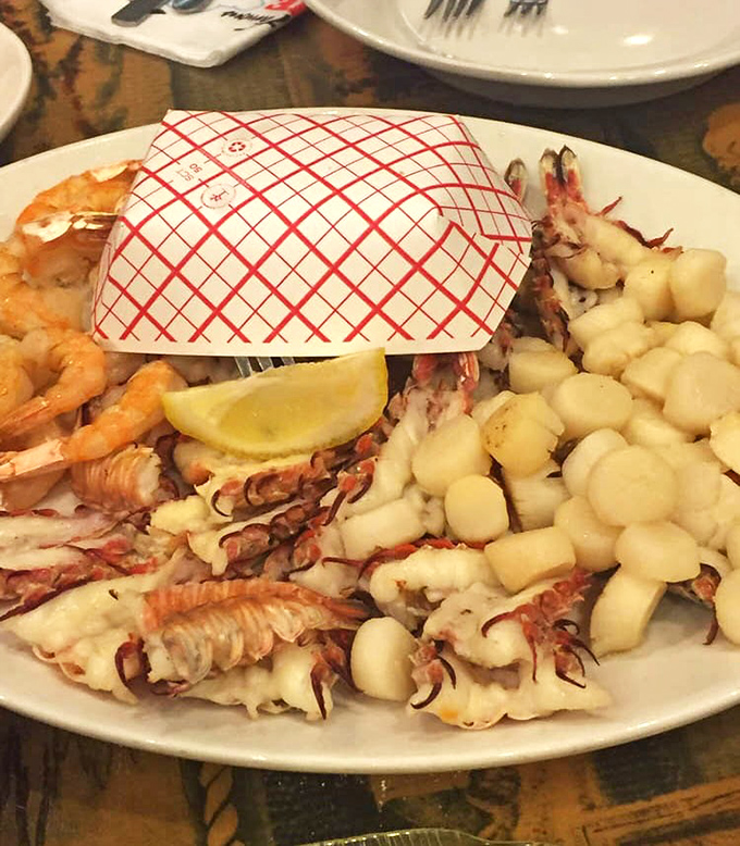 The seafood platter that launches a thousand road trips &ndash; scallops, lobster, and shrimp sharing real estate on one glorious plate.