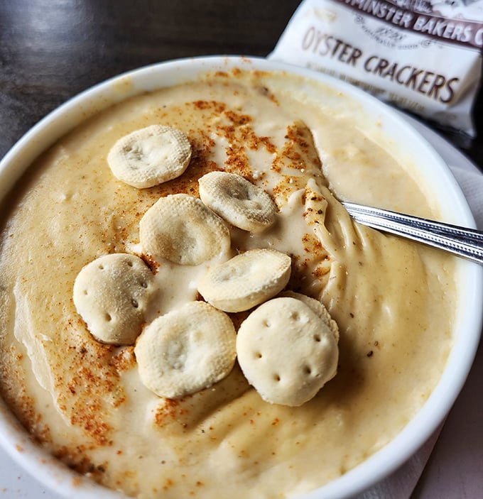 This isn't just soup; it's a butterscotch-hued bowl of Virginia tradition. Those oyster crackers aren't garnish&mdash;they're little lifeboats of crunch.