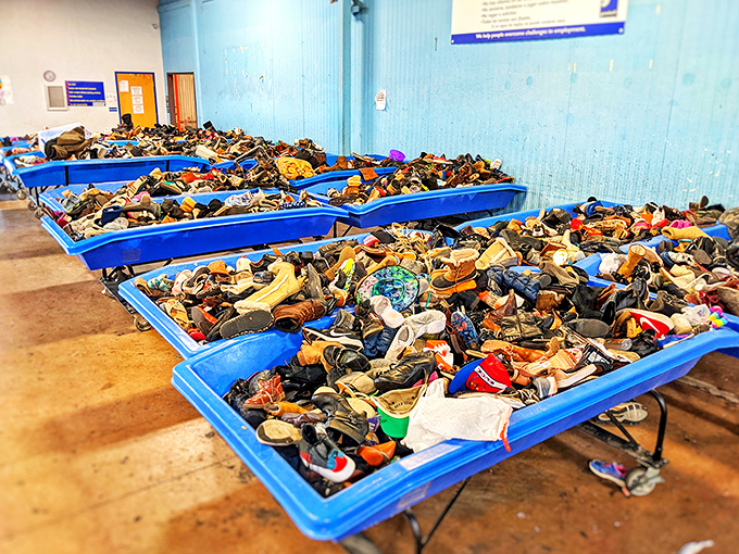 A sea of footwear possibilities stretches to the horizon. Somewhere in this blue bin galaxy is the perfect pair waiting for its Cinderella moment.