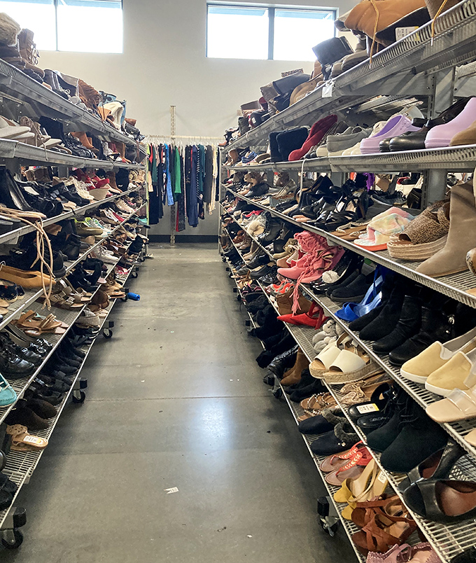 Rows of shoes stretching into the distance like a footwear runway show where everything's marked down to reality-check prices.