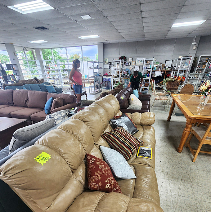 Furniture shopping becomes a social experience here, where fellow bargain hunters navigate the sea of comfortable seating options.
