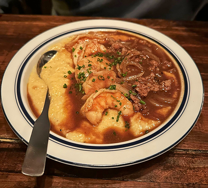 Behold the legendary shrimp and grits &ndash; plump crustaceans lounging on creamy cornmeal islands, all swimming in a sauce that should be illegal in seven states.