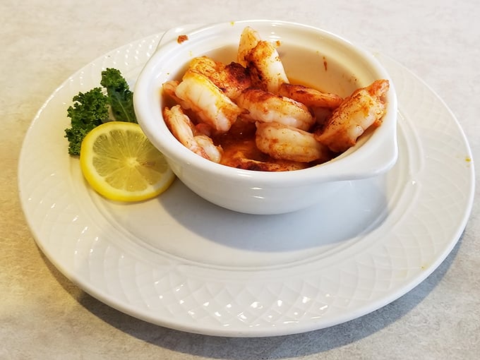 Perfectly seared shrimp that would make Neptune himself jealous, served with a lemon wedge that's not just for show. Dive in!