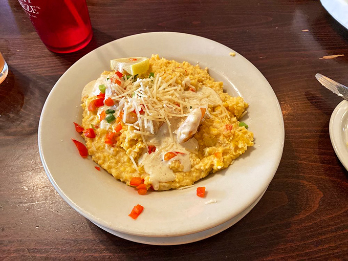 Not just shrimp and grits &ndash; this is the dish that launches road trips and ruins lesser versions forever. The cheese pulls rank in the most delicious way possible.