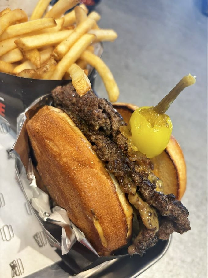 Behold the burger in its natural habitat&mdash;crispy-edged patty, melty cheese, golden bun. That cascabella pepper standing guard isn't just for show.