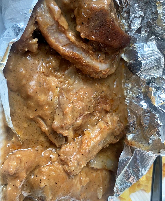 These smothered pork chops aren't just swimming in gravy&mdash;they're doing the backstroke in a pool of savory, soul-warming goodness that demands to be sopped up.