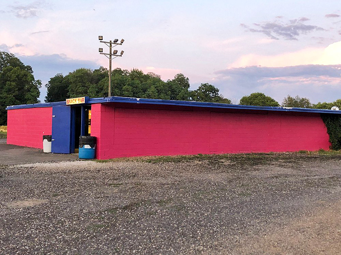 The snack bar's vibrant red and blue color scheme screams "Americana" louder than a bald eagle eating apple pie.