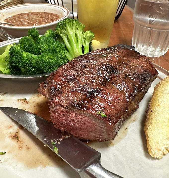 This isn't just a steak; it's a masterpiece of simplicity. The perfect char, the rosy interior, the juices that make you want to frame the plate rather than eat from it.