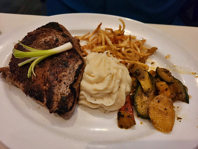 That perfectly crusted steak with crispy onions might just redefine everything you thought you knew about proper meat preparation.