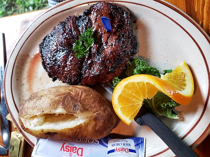 A perfectly seared steak with a baked potato that's practically begging to be devoured. This isn't just dinner; it's a celebration.