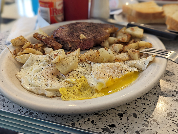 Behold the legendary steak and eggs&mdash;a plate that could make a vegetarian question their life choices. The runny yolks create nature's perfect sauce for those seasoned home fries.