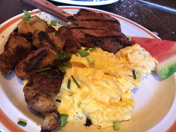 This isn't just breakfast; it's morning poetry on a plate. The steak bears perfect grill marks while those eggs practically glow with golden promise.