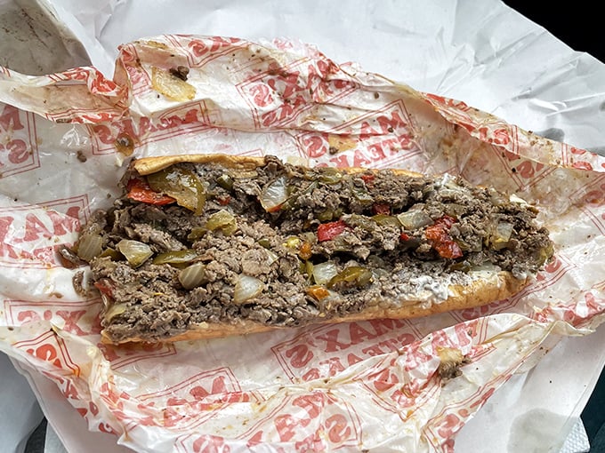 Behold the star of the show: thinly sliced sirloin, perfectly grilled with onions, nestled in a roll that's somehow both sturdy and yielding.