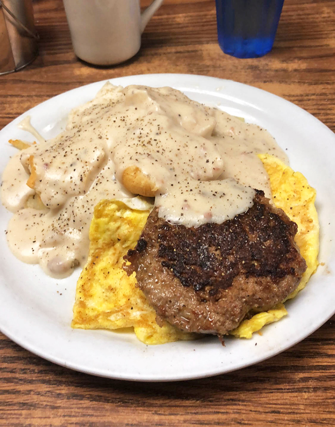 Behold the star attraction: steak and eggs swimming in country gravy. This plate has launched a thousand flights and cured just as many hangovers.