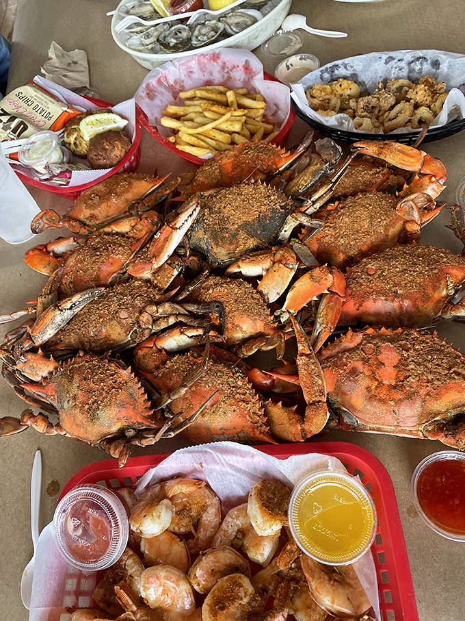 Behold the main event: Old Bay-crusted steamed crabs, ready for the picking. This mountain of crustacean perfection is Baltimore on a platter.