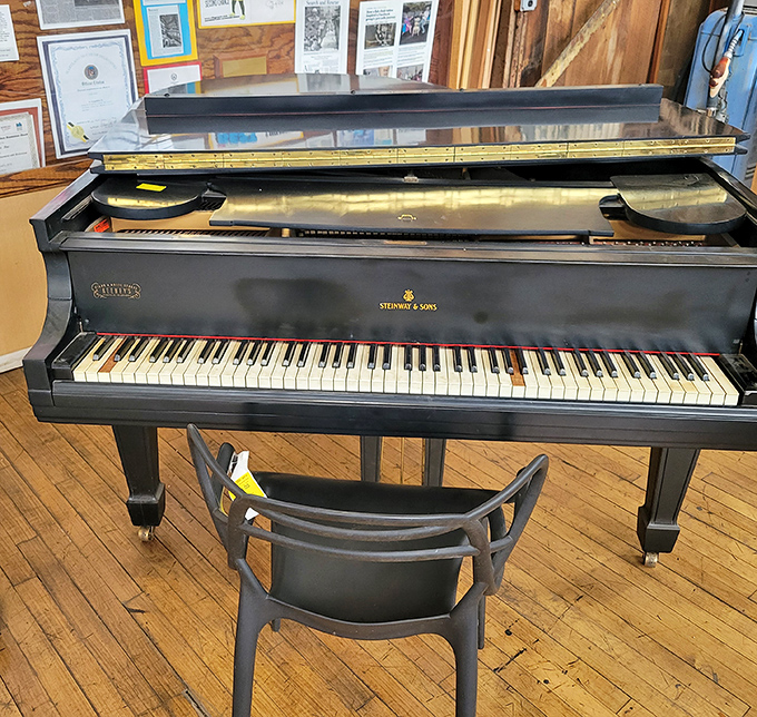A genuine Steinway & Sons grand piano waiting for someone to tickle those ivories back to their former glory days.