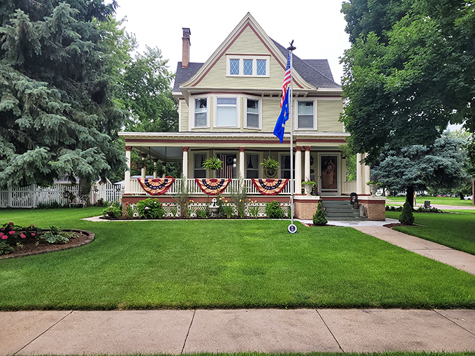 This patriotic Victorian beauty with its wraparound porch practically whispers, "Sit a spell and watch the world go by at 5 mph."