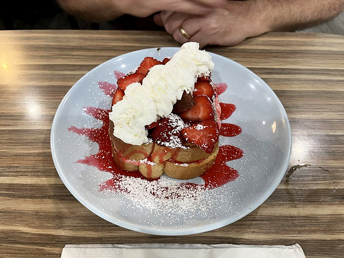 The legendary Stuffed Strawberry Cream French Toast in its natural habitat&mdash;a masterpiece of bread, berries, and cream that's worth crossing state lines for.