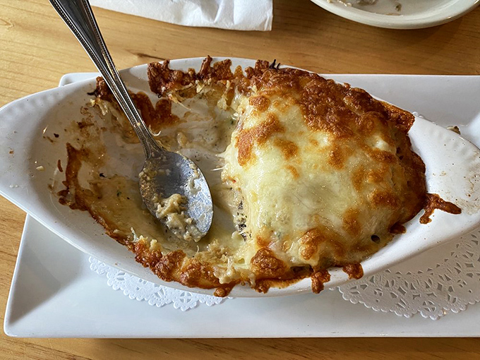 These stuffed mushrooms aren't just appetizers &ndash; they're a religious experience of bubbling cheese and savory filling that might make you forget about the steaks altogether.