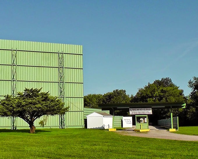The classic green-paneled screen towers over the landscape, a monument to simpler times when entertainment didn't require a password or subscription.