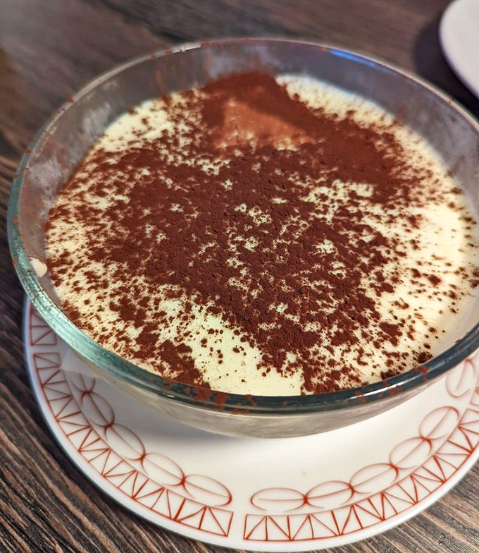 This tiramisu isn't just dessert; it's a cloud of mascarpone heaven dusted with cocoa that makes you question why you ever waste calories on lesser sweets.
