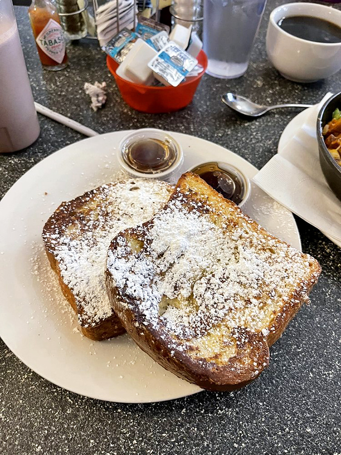 The French toast that launched a thousand return visits. Dusted with powdered sugar and served with real maple syrup&mdash;this is breakfast royalty.