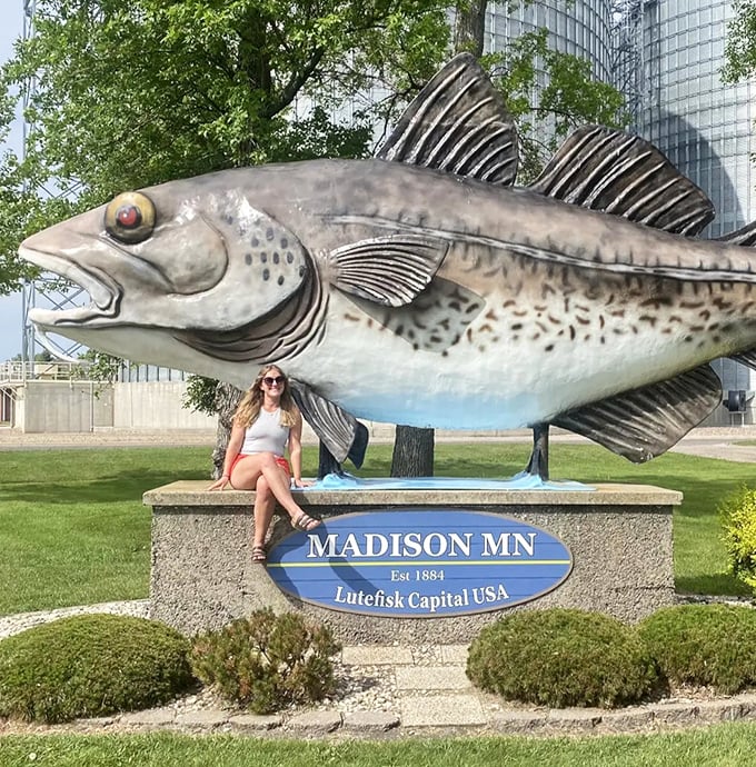 The perfect photo op: tourist finds the statue's base makes an ideal perch for capturing that "I survived the lutefisk" moment.