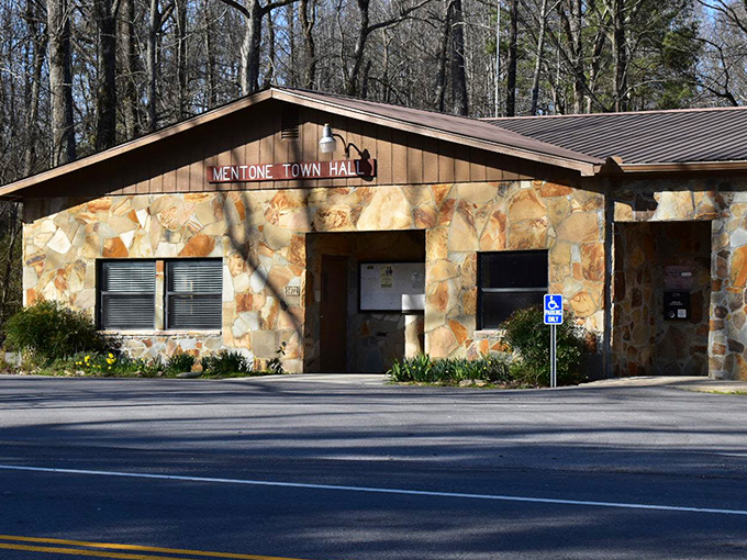Mentone Town Hall, with its distinctive stone facade, stands as the humble nerve center of mountain governance&mdash;no marble columns needed here.