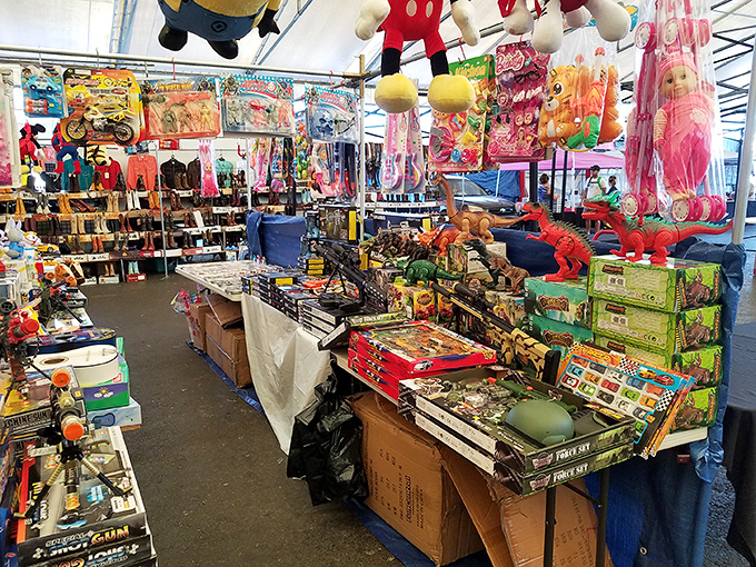 Toy paradise where childhood dreams hang from the ceiling. That Minion plushie is silently judging your adult decision not to buy it.