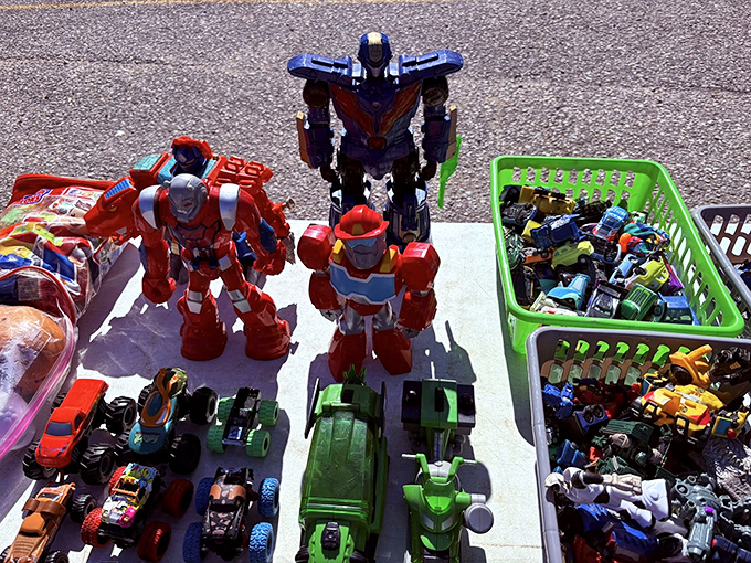 Transformer robots stand guard over Hot Wheels and action figures, silently promising adventures to kids and collectors alike.