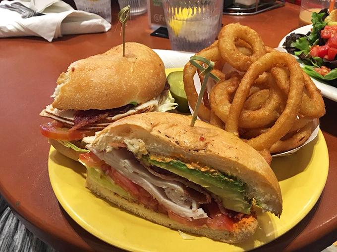 This isn't just a club sandwich&mdash;it's architectural genius with perfectly layered turkey, bacon, and avocado between golden toast.