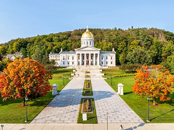 The gold-domed State House stands like a gleaming beacon of democracy, somehow both grand and approachable against its forested hillside.