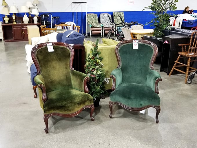 These velvet Victorian chairs aren't just furniture – they're time machines upholstered in "I could tell you stories" green.