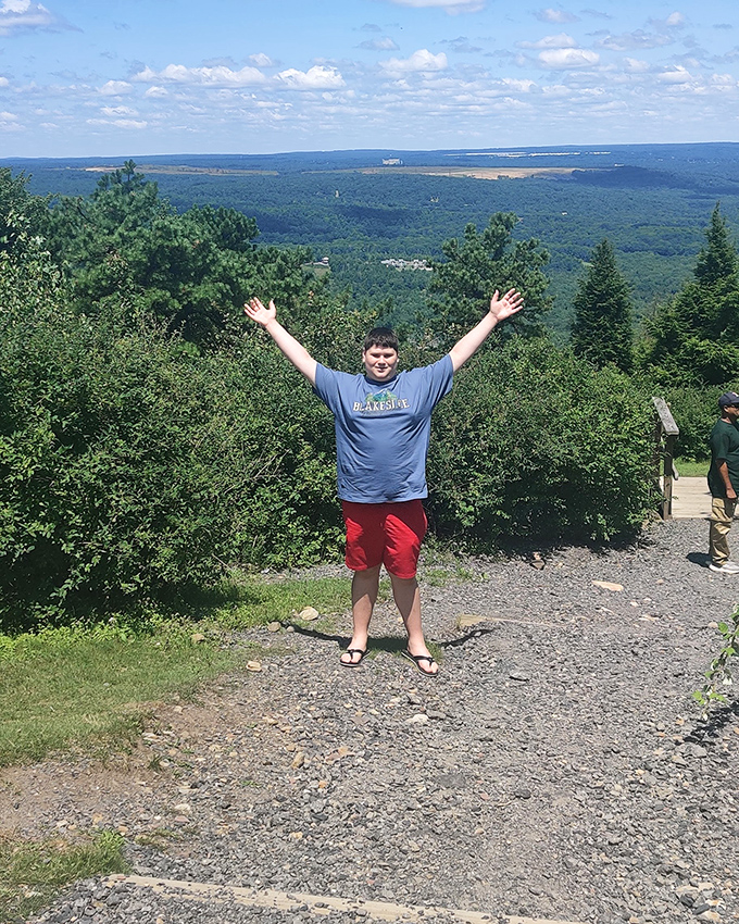 Joy looks exactly like this: arms outstretched at 2,100 feet, embracing a view that makes your everyday worries seem as small as they should be.