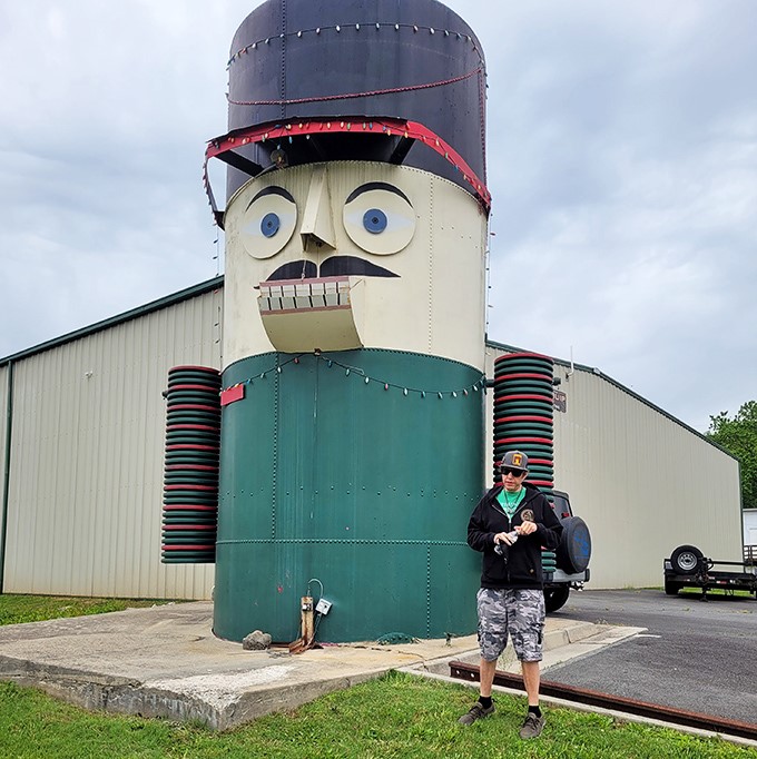 Visitors provide scale to this towering creation, proving that sometimes the best roadside attractions make us feel delightfully small.