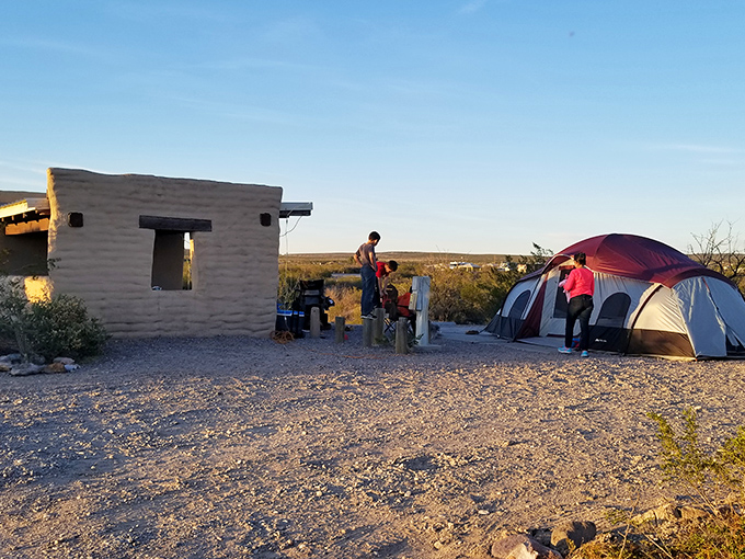 Desert camping at its finest—where the adobe shelter and colorful sunset make you forget you're sleeping on what is essentially nature's hardwood floor.